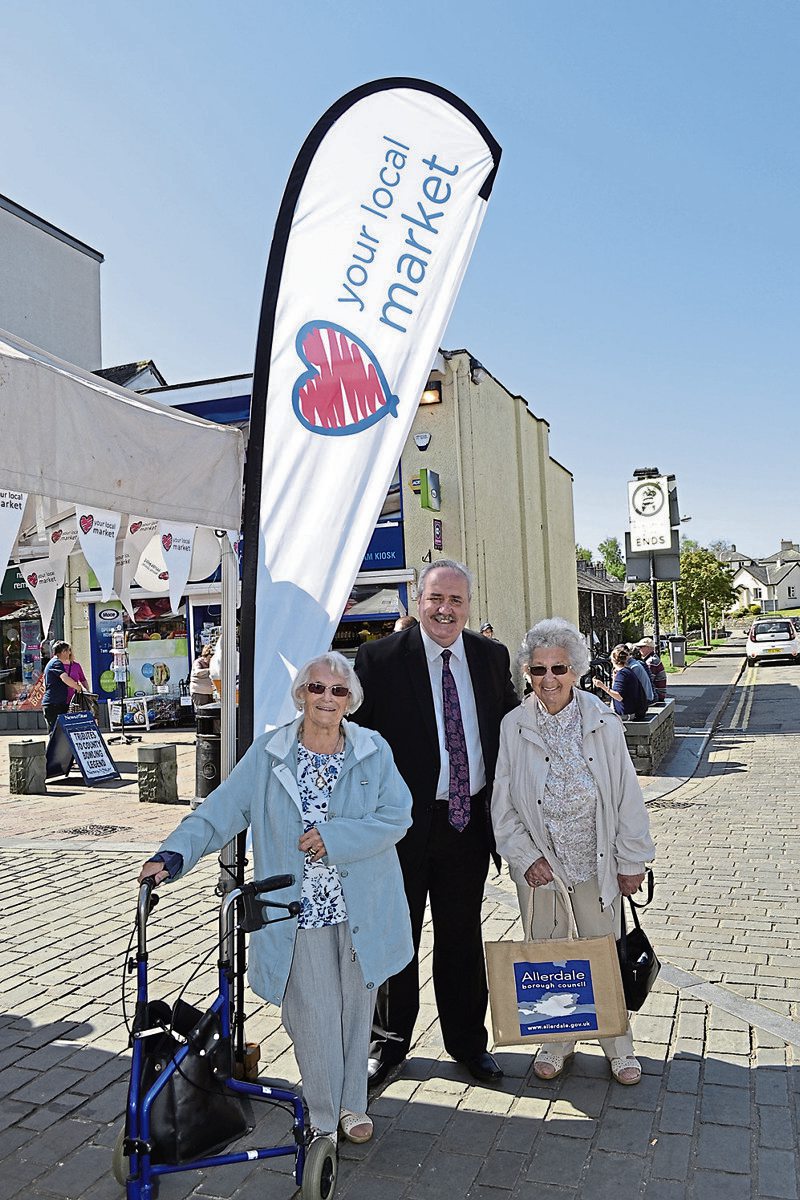 Two of the market’s regular shoppers pose with their new town shopper ...